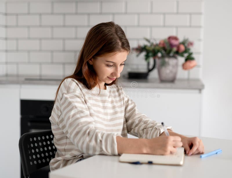 Girl doing homework stock image. Image of student, writing - 79003833