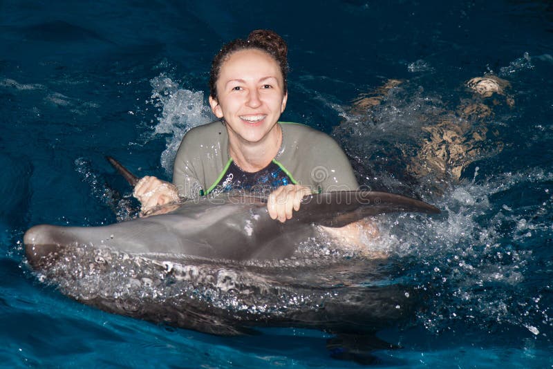 Happy girl and dolphin stock image. Image of beautiful - 22988279