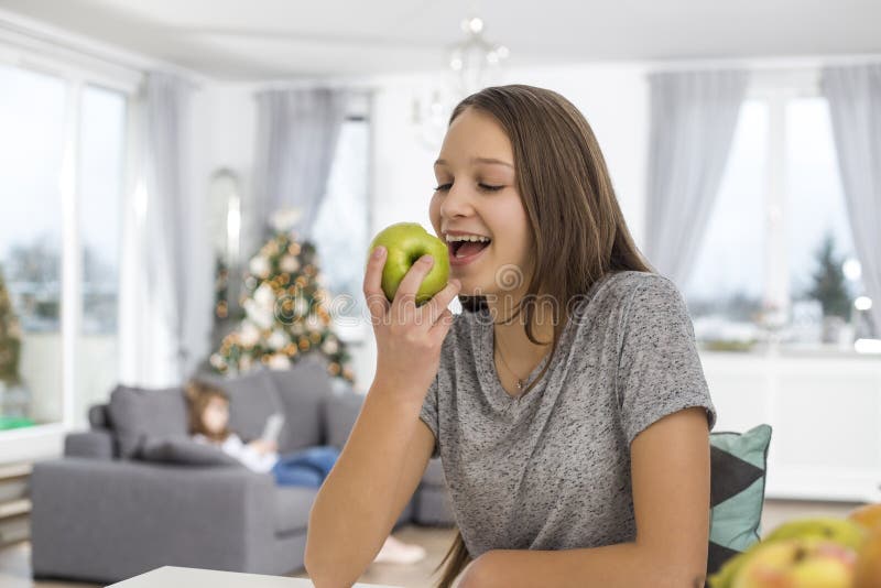 Happy Girl Eating Apple at Home Stock Image - Image of open, house ...