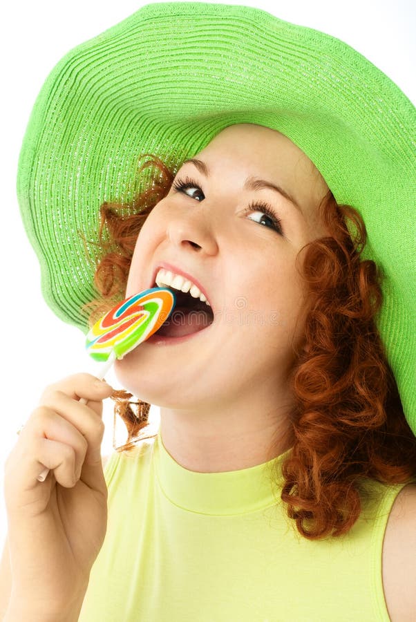 Happy Girl Eating A Candy Picture. Image: 7821649