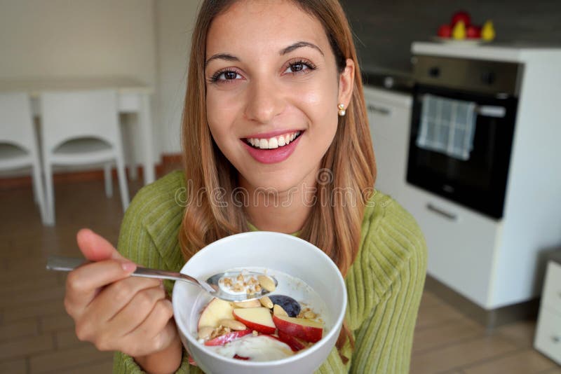 Happy Girl Eating Cereals at Home Stock Photo - Image of care ...