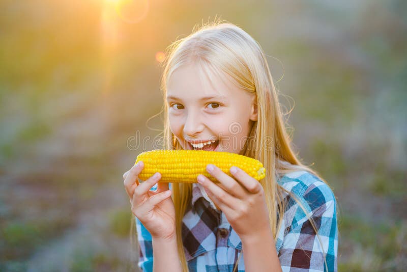 Happy Girl Eating Healthy Corn on the Cob Stock Photo - Image of corn ...