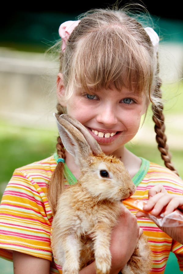 Little girl with a rabbit stock image. Image of paws, fauna - 1721423