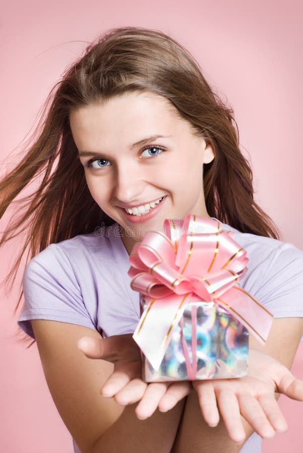 Happy girl with a gift stock photo. Image of package - 24379470