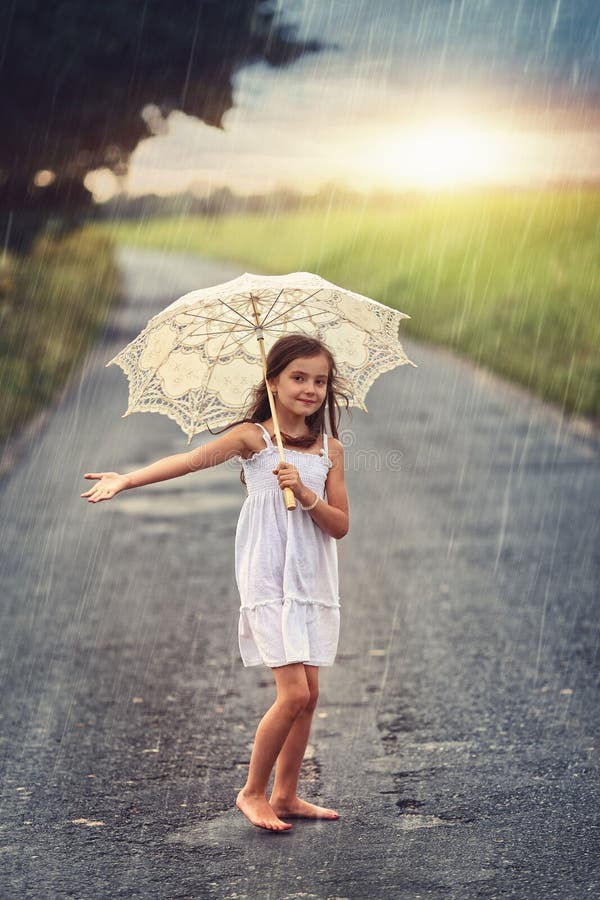 Happy Girl Hiding from the Rain Under the Umbrella Stock Image - Image ...