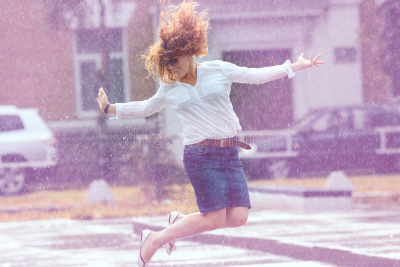 Happy Girl Jumping in Puddle Stock Photo - Image of girl, autumn: 63781106