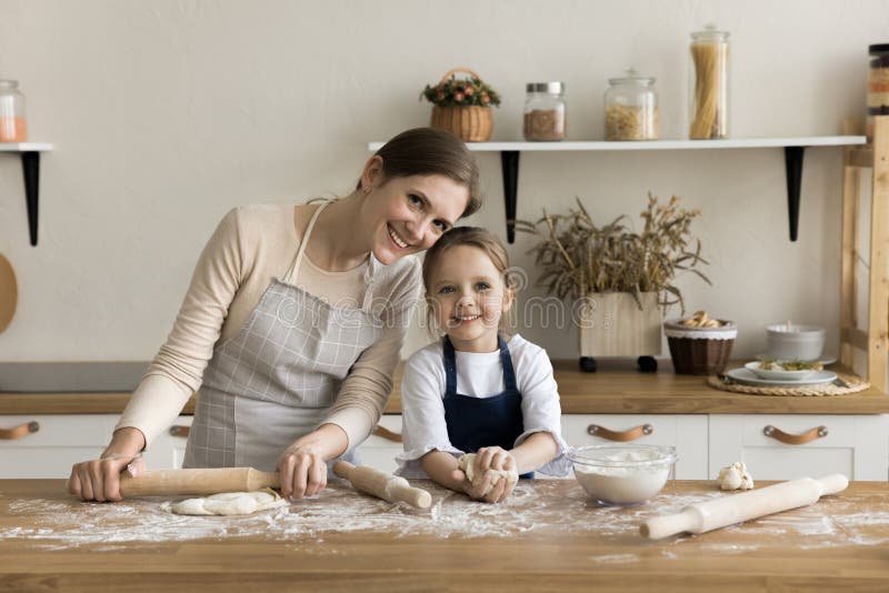 Happy Girl and Mom in Aprons Baking in Home Kitchen Stock Image - Image ...