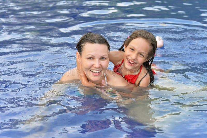 Happy Girl and Mother in Pool Stock Photo - Image of waterpark, people ...