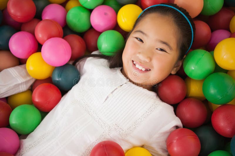 Happy Girl Playing in Ball Pool Stock Image - Image of casual, happy ...