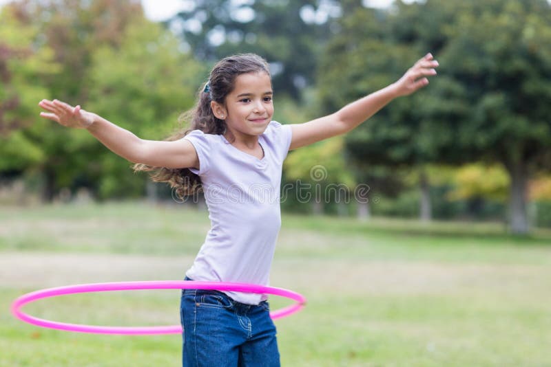 Girl Hula Hooping stock photo. Image of girl, happy, motion - 5661808