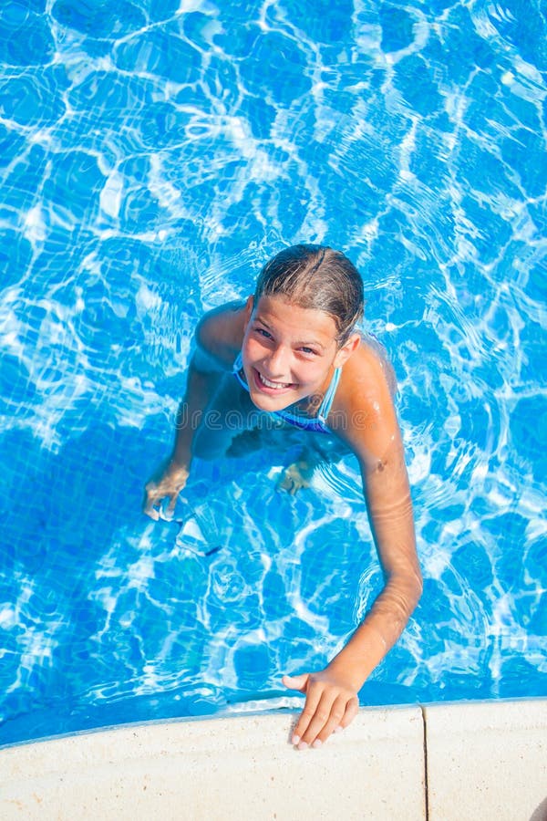 Happy girl in the pool stock photo. Image of active, blue - 46127914