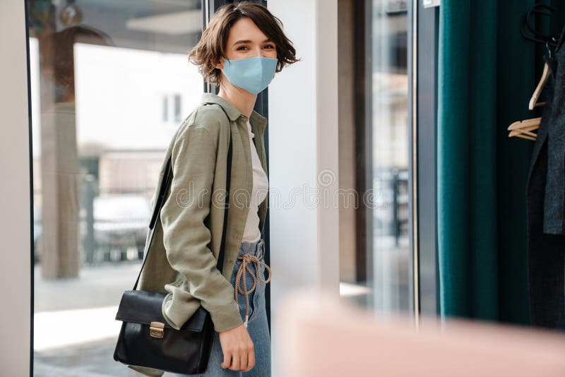 Happy Girl in Protective Mask Looking at Camera while Standing Stock ...