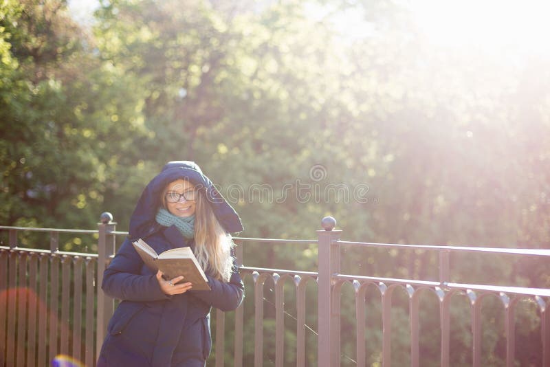 Happy Girl Reading a Book at the Railing. Stock Photo - Image of alone ...