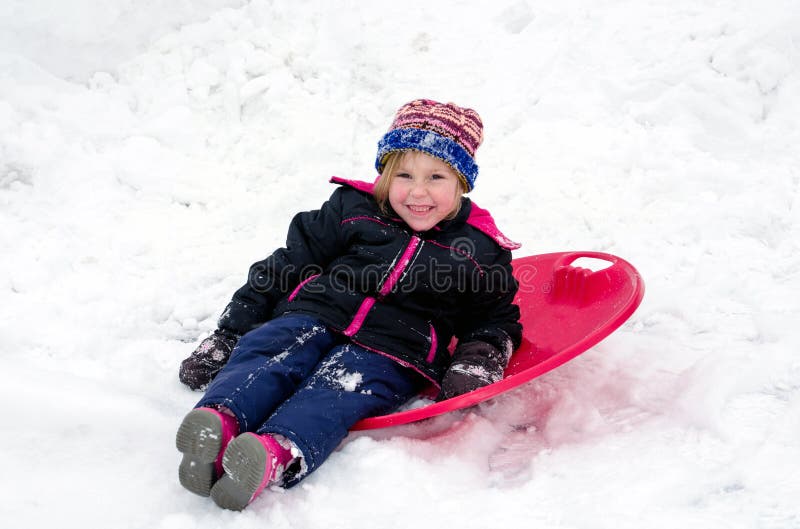 Girl sledding down a hill stock image. Image of sled - 42977865