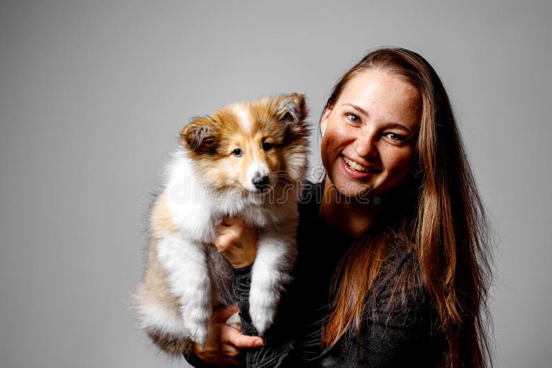 Happy Girl with Sheltie Puppy Stock Image - Image of care, laugh: 202902483
