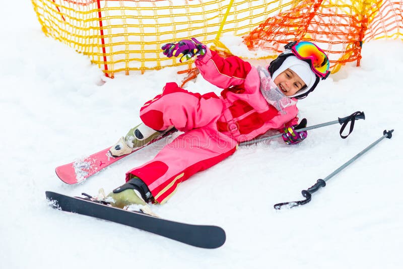 Happy Girl Sitting Down on the Snow Learning Skiing. Stock Photo ...