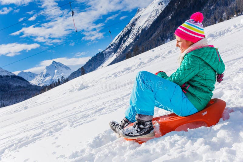 Happy girl sledding stock photo. Image of outside, fast - 63483888