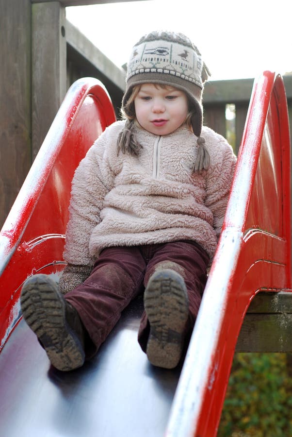 Happy girl on a slide stock photo. Image of children - 22783838