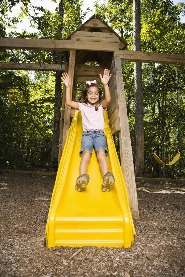 Happy girl sliding. stock image. Image of photograph, brunette - 4246745