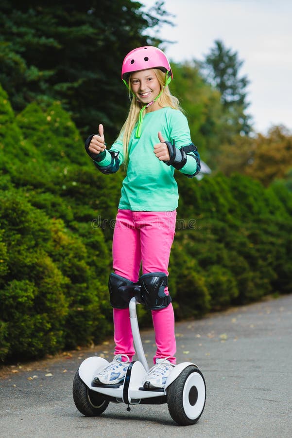 Happy Girl Standing on Hoverboard or Gyroscooter Outdoor Stock Image ...