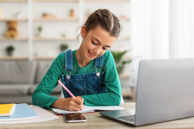 Pupil Sitting on Floor and Using Her Persinal Laptop Computer Stock ...