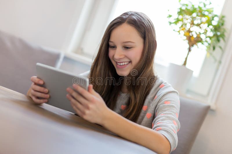 Happy Girl Using Digital Tablet at Home Stock Image - Image of ...