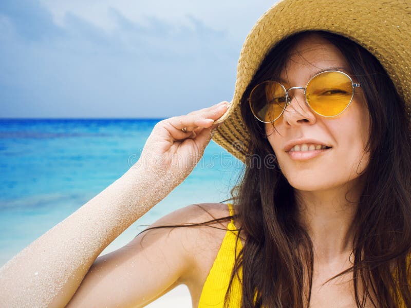 Happy Girl On Vacation Young Brunette In A Straw Hat And Sunglasses