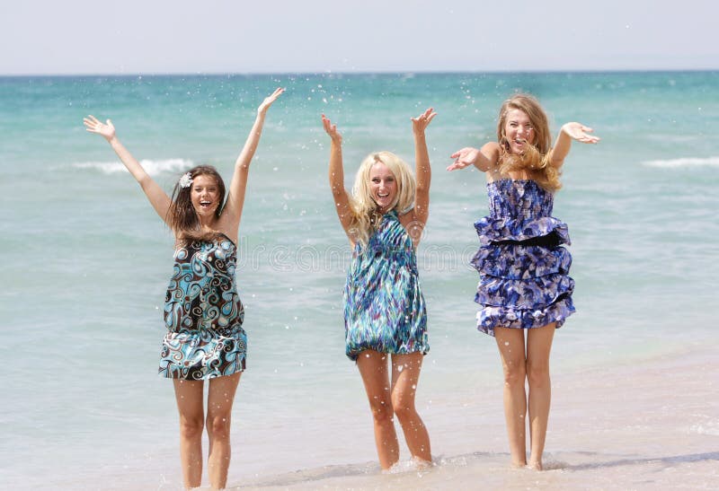 Happy girls on beach stock photo. Image of beach, joyful - 15686800