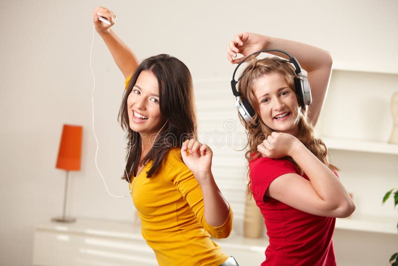 Happy Girls Dancing To Music Stock Photo - Image of indoor, friendship ...