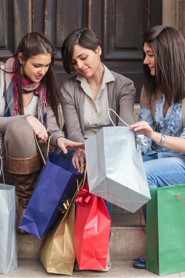 Happy girls doing shopping stock image. Image of group - 24354515
