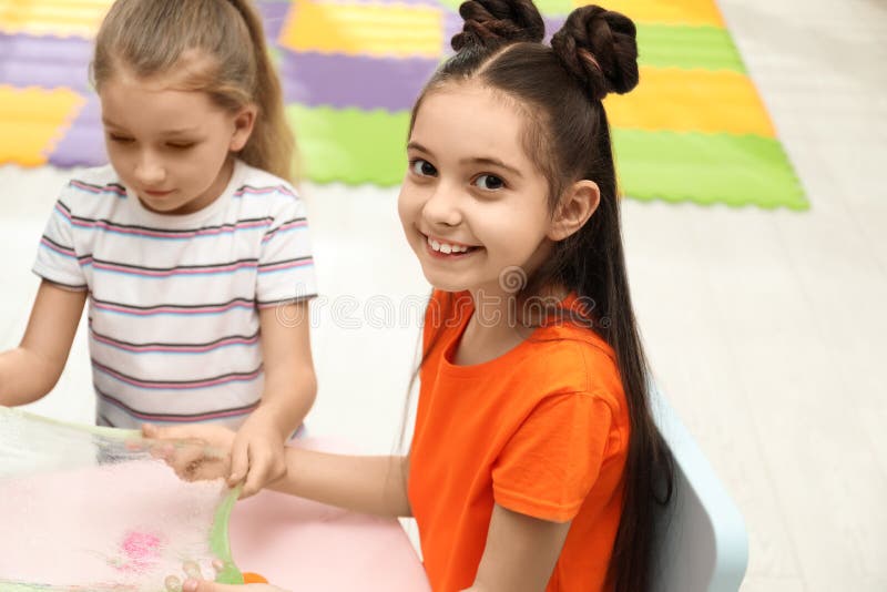 Happy Girls Playing with Slime at Table Stock Photo - Image of fluffy ...