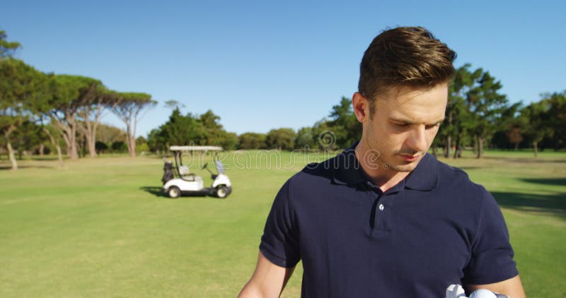 Happy Golf Player Examining the Golf Ball Stock Video - Video of ...