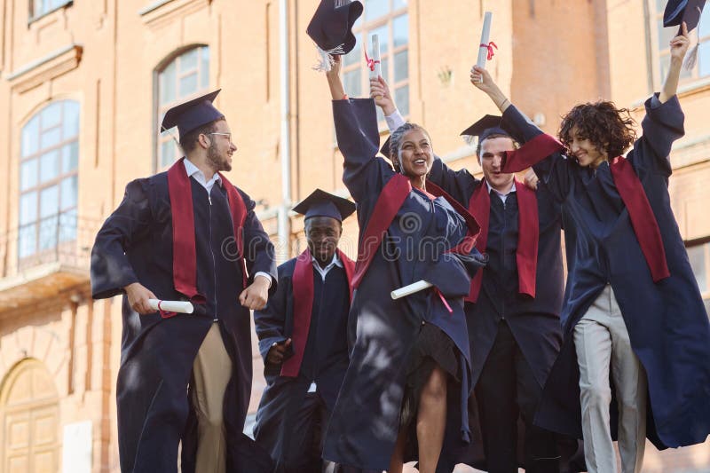 Happy Graduated Students in Robes Stock Image - Image of together ...