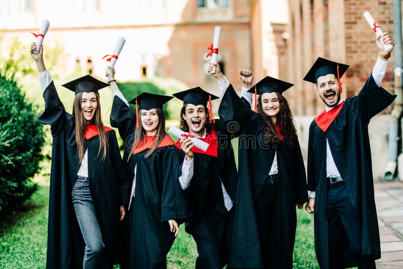 Happy Graduates. Five College Graduates Standing in a Row and Smiling ...