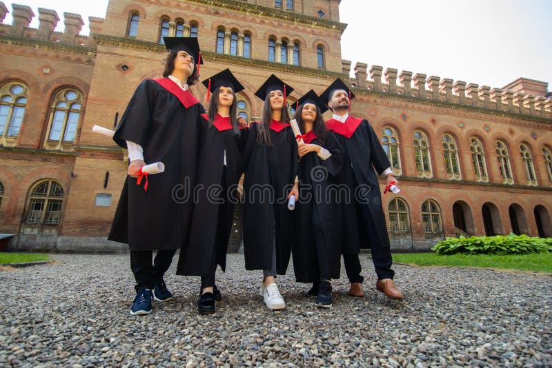 Happy Graduates. Five College Graduates Standing in a Row and Smiling ...