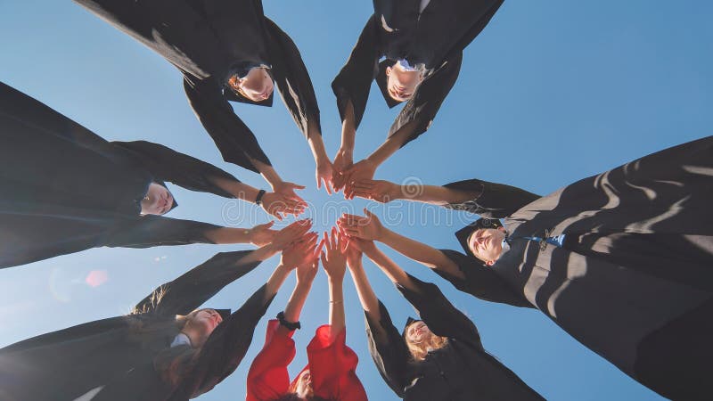 Happy Graduates Join Hands Disperse Stock Photos - Free & Royalty-Free ...