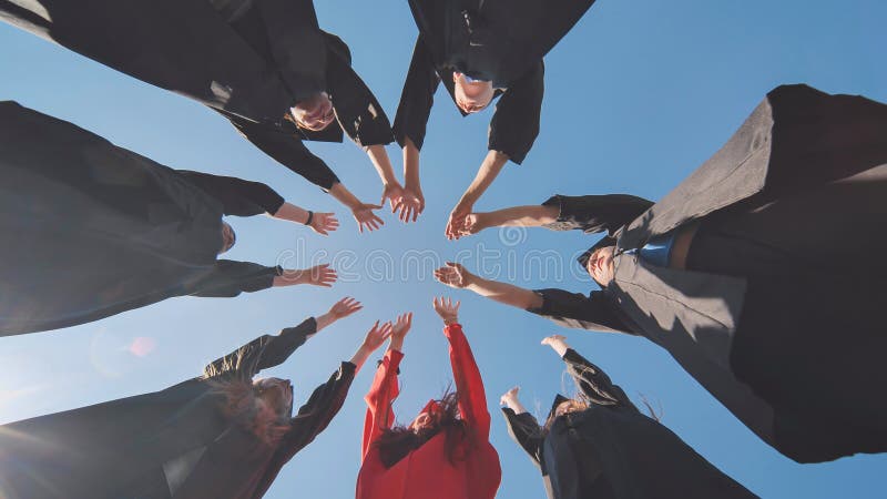 The Happy Graduates Join Hands and Disperse. Stock Image - Image of ...