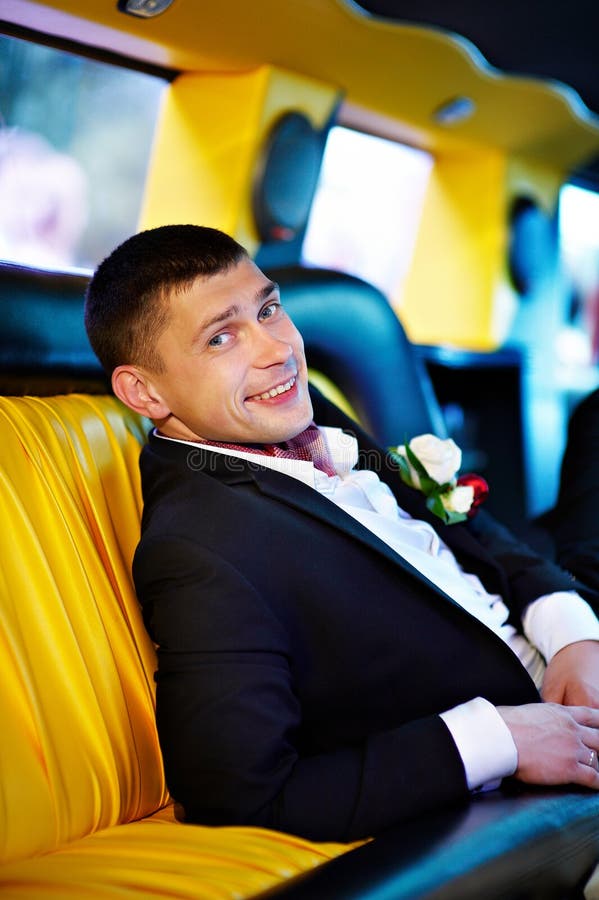 Happy Groom Hugging Beautiful Bride with Bouquet from Behind Near ...