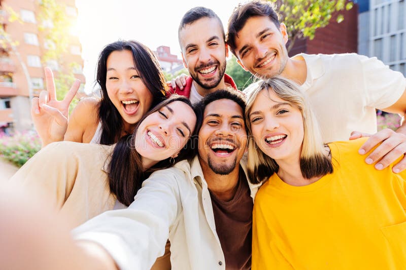 Happy Group Of Diverse Friends Taking Selfie Portrait Together Using