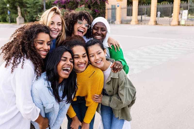 Happy Group Of Diverse Women Friends Hugging Each Other Posing For