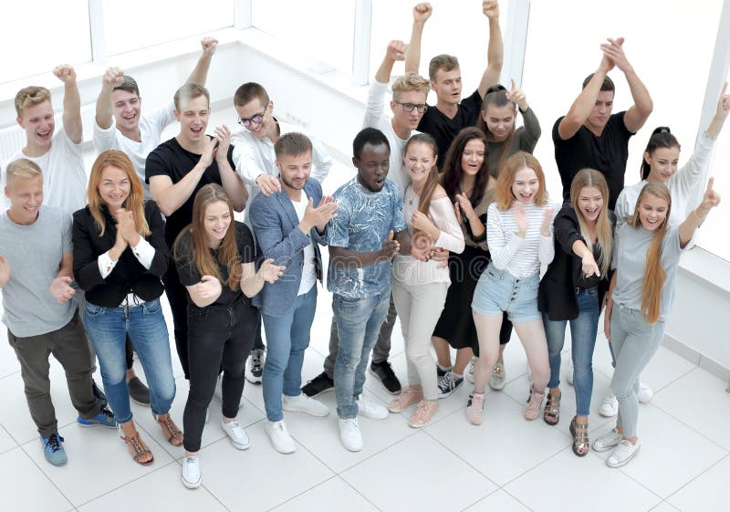Happy Group of Diverse Young People Holding Their Hands Up Stock Photo ...