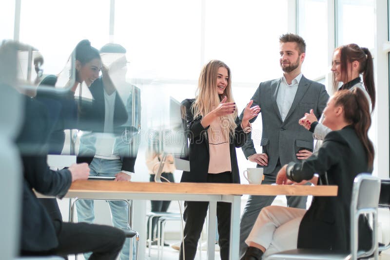 Happy Group of Employees Discussing Something Standing in the Office ...