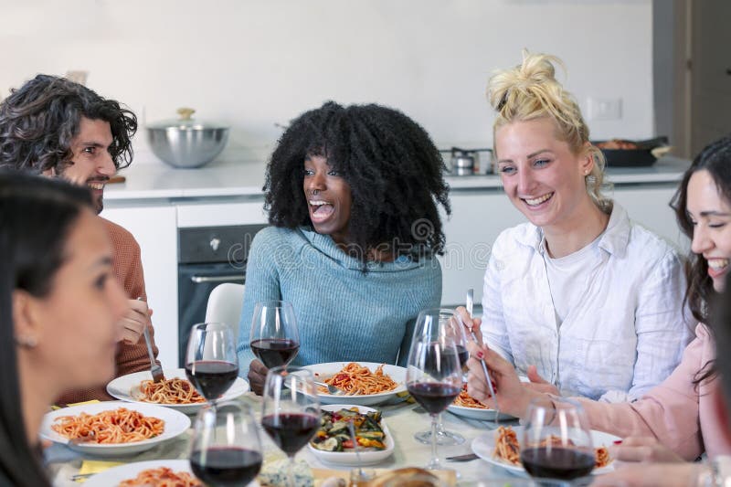 Happy Group of Friends Eating Pasta at Home Dinner Party Stock Image ...