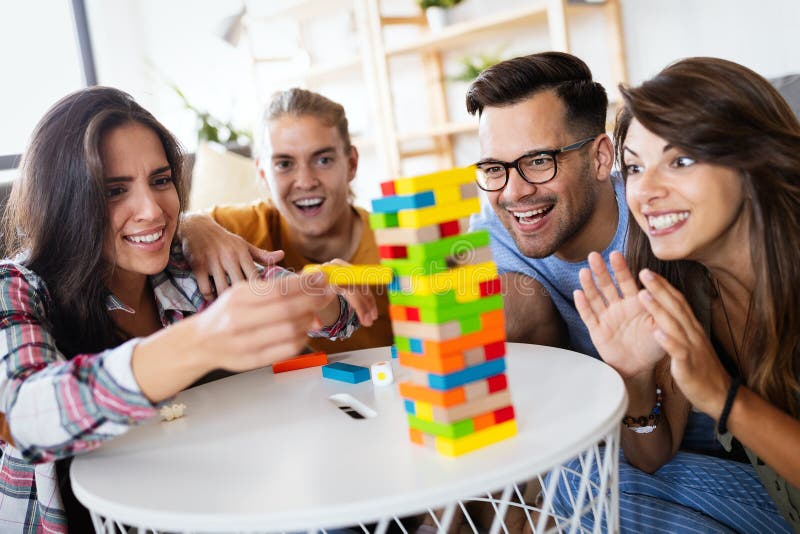 Happy Group of Friends Have Fun and Playing Board Game Together Stock ...