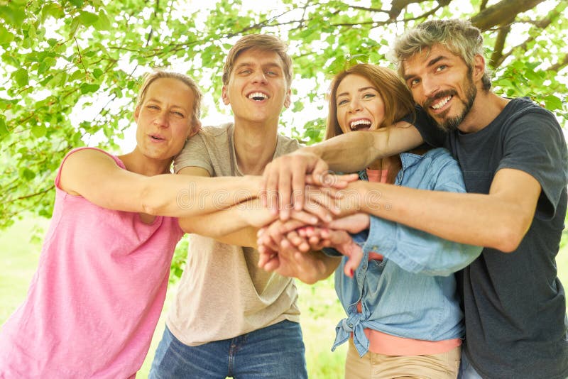 Happy Group of Friends while Stacking Hands Stock Photo - Image of ...