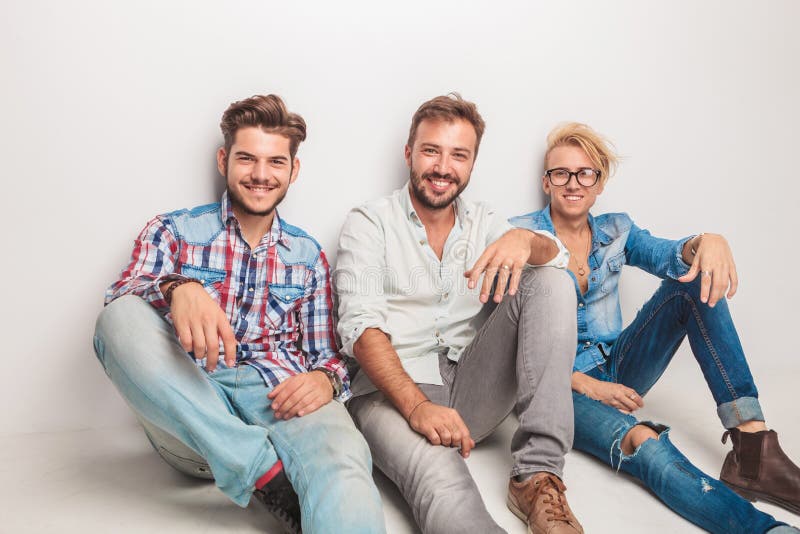 Happy Group of Men Laughing for the Camera while Sitting Stock Image ...