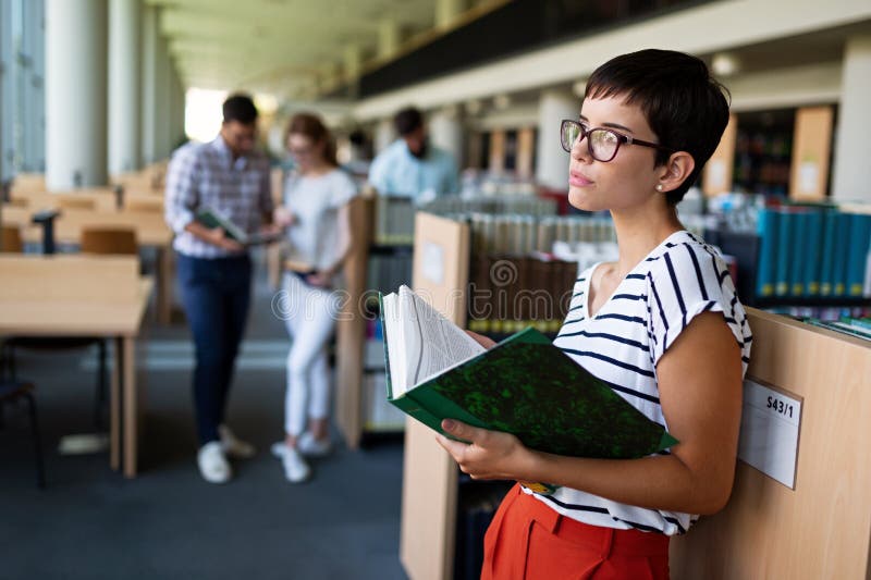 Happy Group of Students Studying and Working Together in a College ...