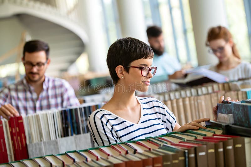 Happy Group of Students Studying and Working Together in a College ...