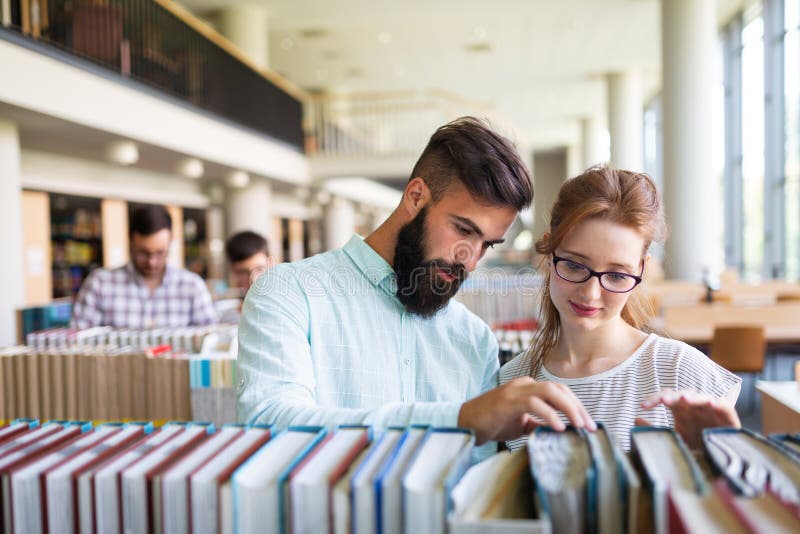 Happy Group of Students Studying and Working Together in a College ...