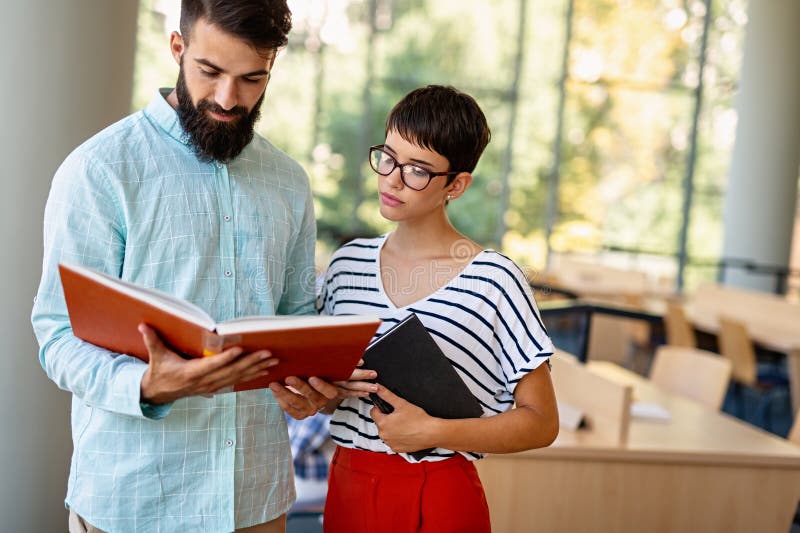 Happy Group of Students Studying and Working Together in a College ...